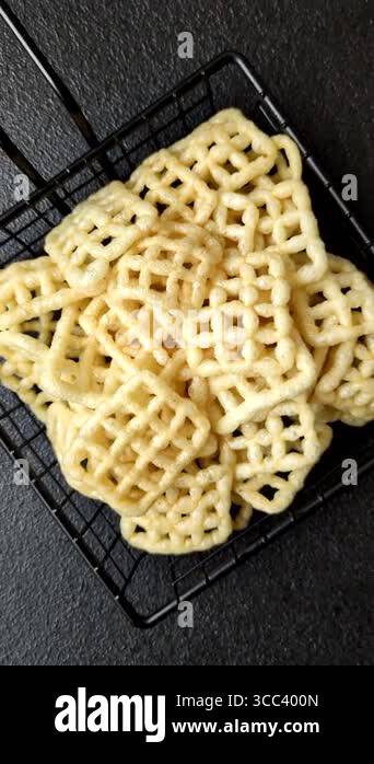 Lattice or wafer potato chips, crispy yellow snacks, takeaway food ...