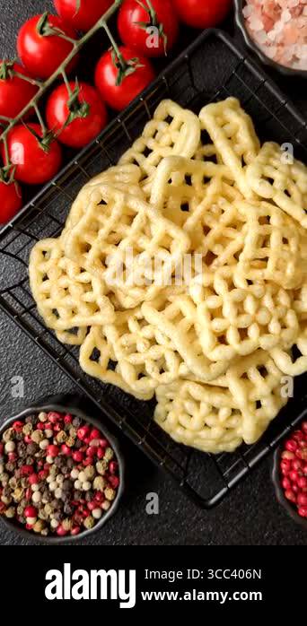 Lattice or wafer potato chips, crispy yellow snacks, takeaway food ...