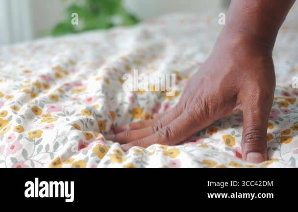 person hand pressing on floral bedding Stock Video Footage - Alamy