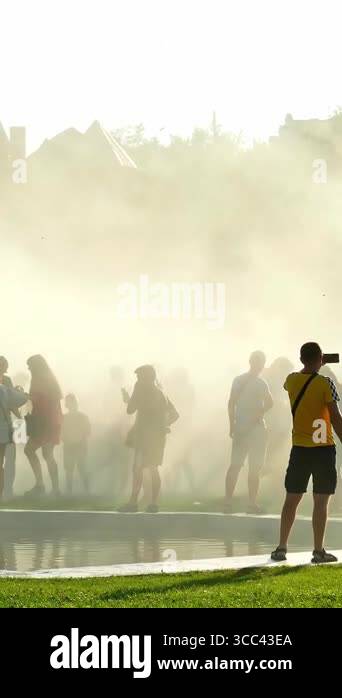 Powder paints. silhouettes of people. back view. crowd of people having ...