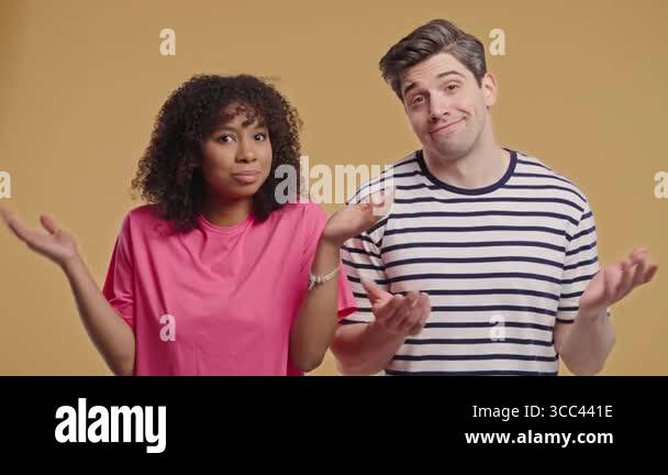Confused mixed ethnicity couple shoulders Stock Videos & Footage - HD ...