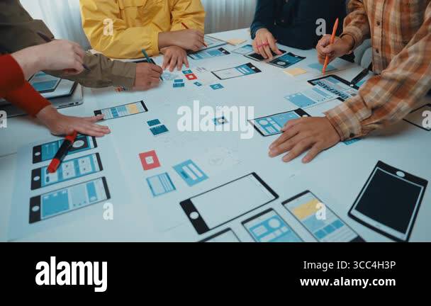 A vibrant scene of a collaborative team meeting focused on user ...