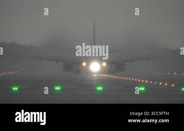 Airplane approaches runway in rainy Stock Videos & Footage - HD and 4K ...