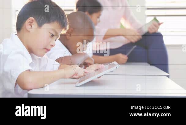 Boys tapping tablets and driving graphs, % figures overlaying classroom ...