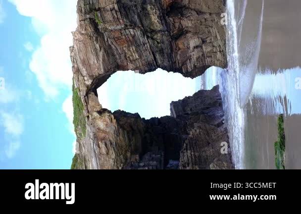 Spectacular natural rock arch formation on the beach of Playa de las ...
