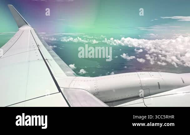 View from screen window of aircraft flying above clouds and Atlantic ...