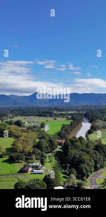 Drone footage captures lush landscapes, winding river, and distant ...