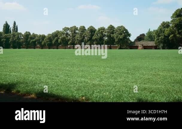 Wide open grassy field in city park in United Kingdom. Green lawn ...