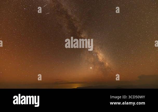 Milky way stretching above glowing horizon at night Stock Video Footage ...