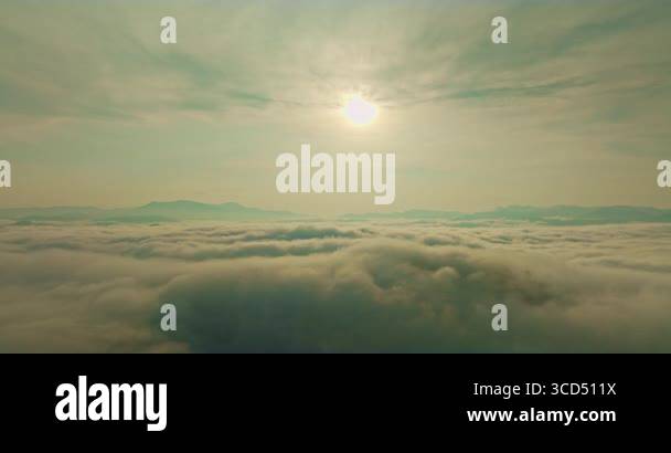 Sun shining above thick rolling clouds landscape Stock Video Footage ...