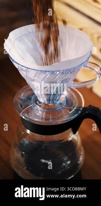 Drip coffee brewing. close-up. barista pours, puts freshly ground ...