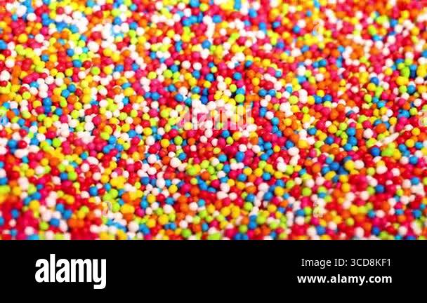 Vibrant sprinkles cascading in a dynamic display Stock Video Footage ...