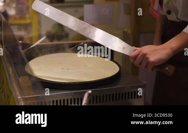 Sequence of preparing and flipping a crepe Stock Video Footage - Alamy