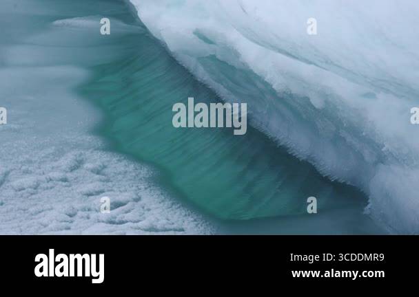 Close-up of the weak area of an iceberg, a dangerous fringe zone where ...