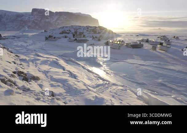 Frozen Arctic winter sea ice rises and falls with the tide, creating a ...