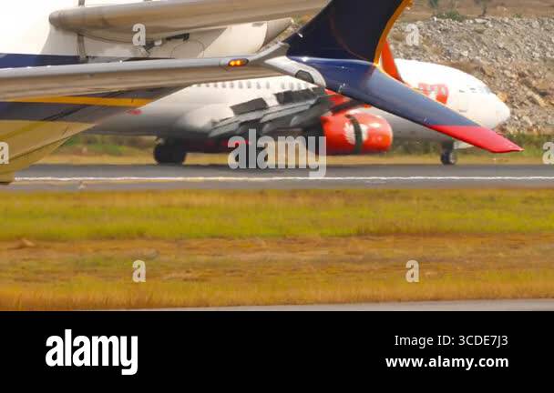 PHUKET, THAILAND - FEBRUARY 17, 2025: Thai Lion Air Boeing 737, HS-LUQ braking after landing at ...