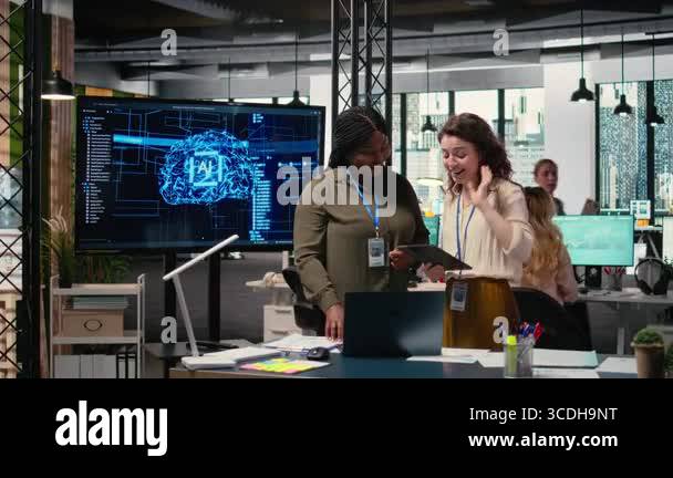 Diverse management staff reviewing advanced AI algorithms and predictive models to enhance ...