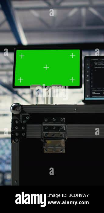 Vertical video Green screen tablet in server room with equipment rigs supporting AI technology ...