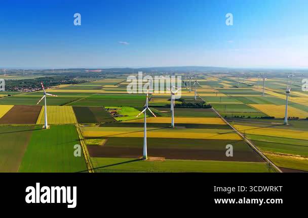 Flight over the picturesque agricultural fields in summer. Multiple ...