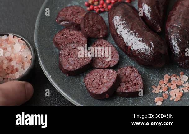 Blood sausage, pudding, meat food with lard and spices. Blood sausage ...