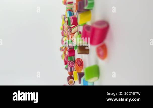 vertical video Explore a world of vibrant candies in various ...