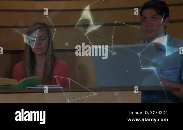 Students studying in lecture hall with drifting network overlay forming ...