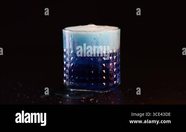 Effervescent blue drink in a textured glass Stock Video Footage - Alamy