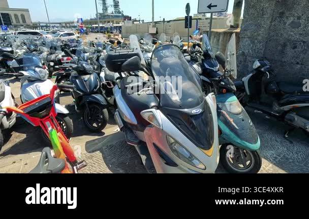 Numerous mopeds parked in a busy area Stock Video Footage - Alamy