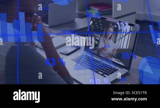 Business professional initiating call from desk, analyzing with ...