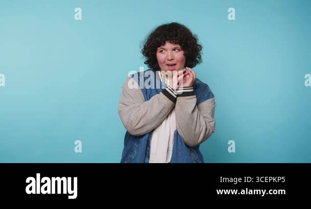 footage of young woman displays a shy mood with a gentle, playful ...