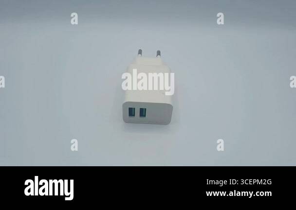 white USB charger adapter with white background Stock Video Footage - Alamy