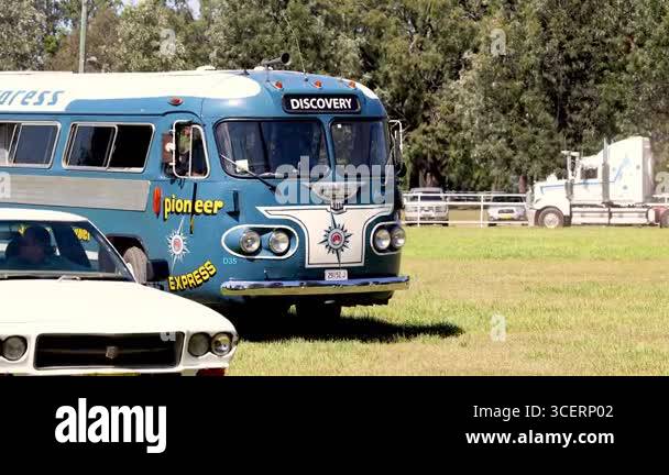 Old-fashioned bus driving through an open field Stock Video Footage - Alamy