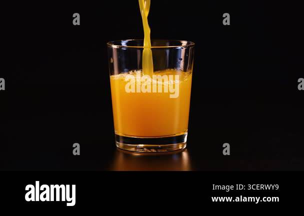 Juice being poured into a glass Stock Video Footage - Alamy