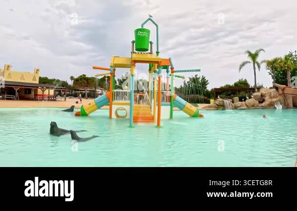 Benidorm, Spain - July 11, 2025: A vibrant water play structure stands ...
