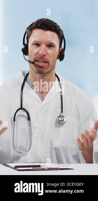 Video of caucasian male doctor on video consultation wearing phone ...