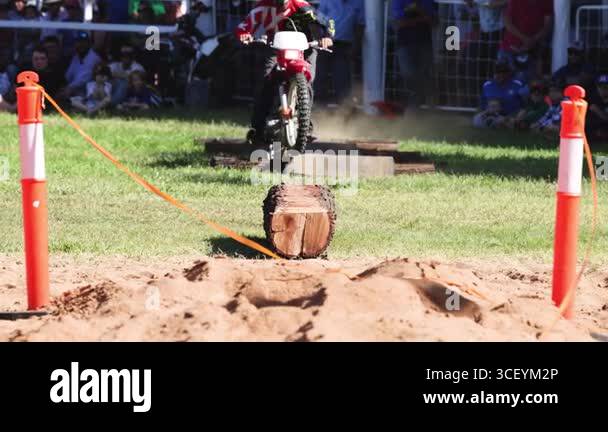 Motorcyclist navigating log obstacle in sandy terrain Stock Video ...