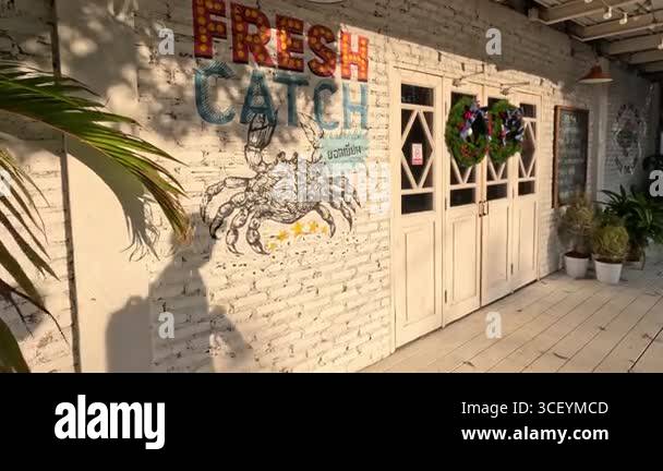 Sunlight casting dynamic shadows on restaurant facade Stock Video ...