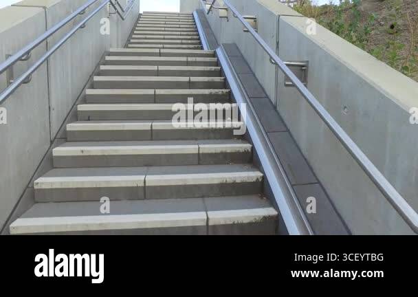 Concrete stairs with metal handrails and integrated rampe for Suitcases ...