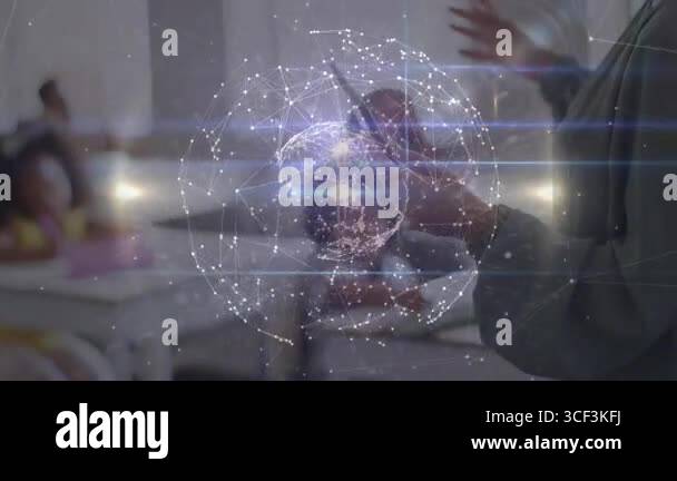 Teacher tapping tablet and gesturing animating hologram globe in class while student writing ...