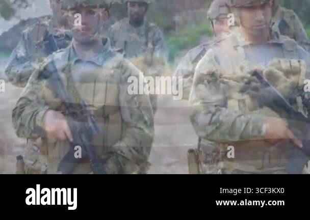 Soldiers moving on patrol order along muddy trail with American flag ...