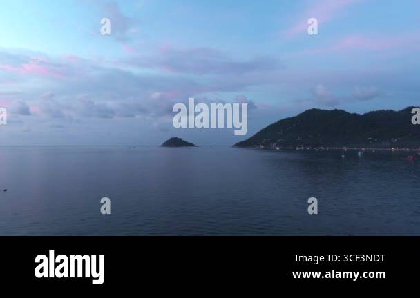 Breathtaking Thai sunset with vibrant colors, calm ocean, ships, clouds ...
