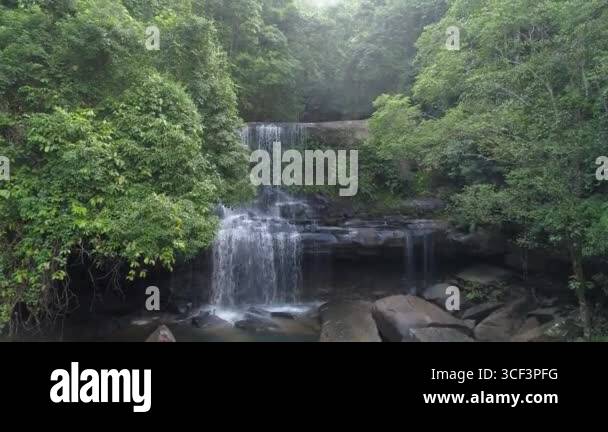 Drone captures sunrise over waterfall in Thai jungle Stock Video ...