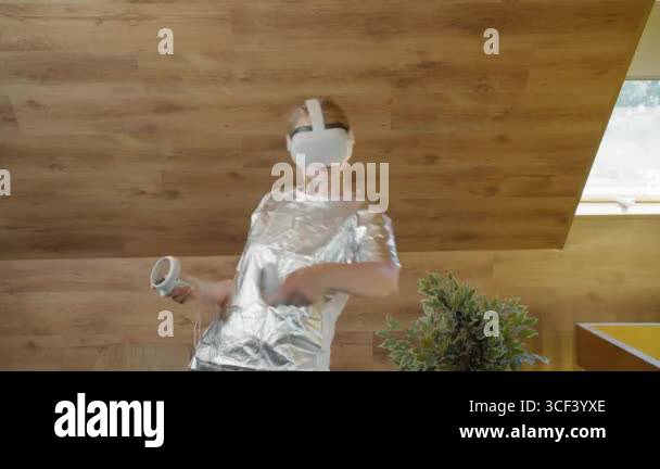 Woman in reflective clothing using virtual reality headset Stock Video ...