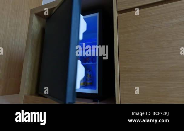 Hand reaching into fridge for a cold drink Stock Video Footage - Alamy