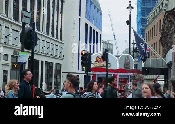 Crowd walking past churro stand in London Stock Video Footage - Alamy