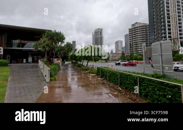 A rainy scene at Broadbeach surf club, showcasing modern architecture ...