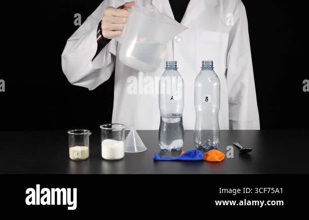 Mixing chemicals in bottles to observe reactions Stock Video Footage ...