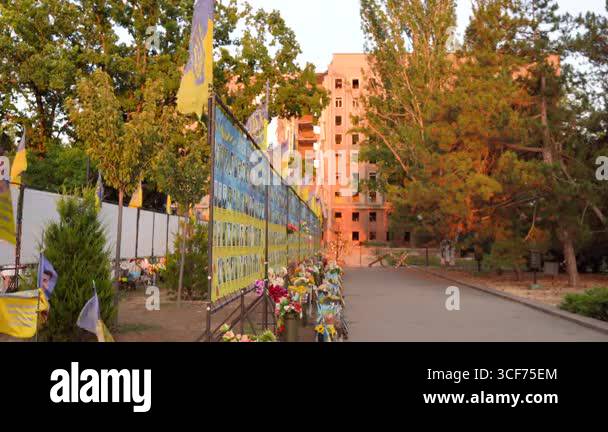 A war memorial alley leads to a partially destroyed building in ...