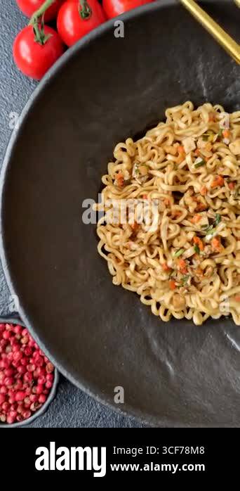 Instant noodles or ramen, Asian food, pasta with vegetables and spices ...