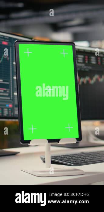 Vertical video Close up of green screen tablet in brokerage company ...